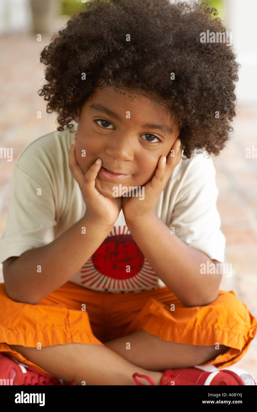 Boy Touching Legs High Resolution Stock Photography and Images - Alamy