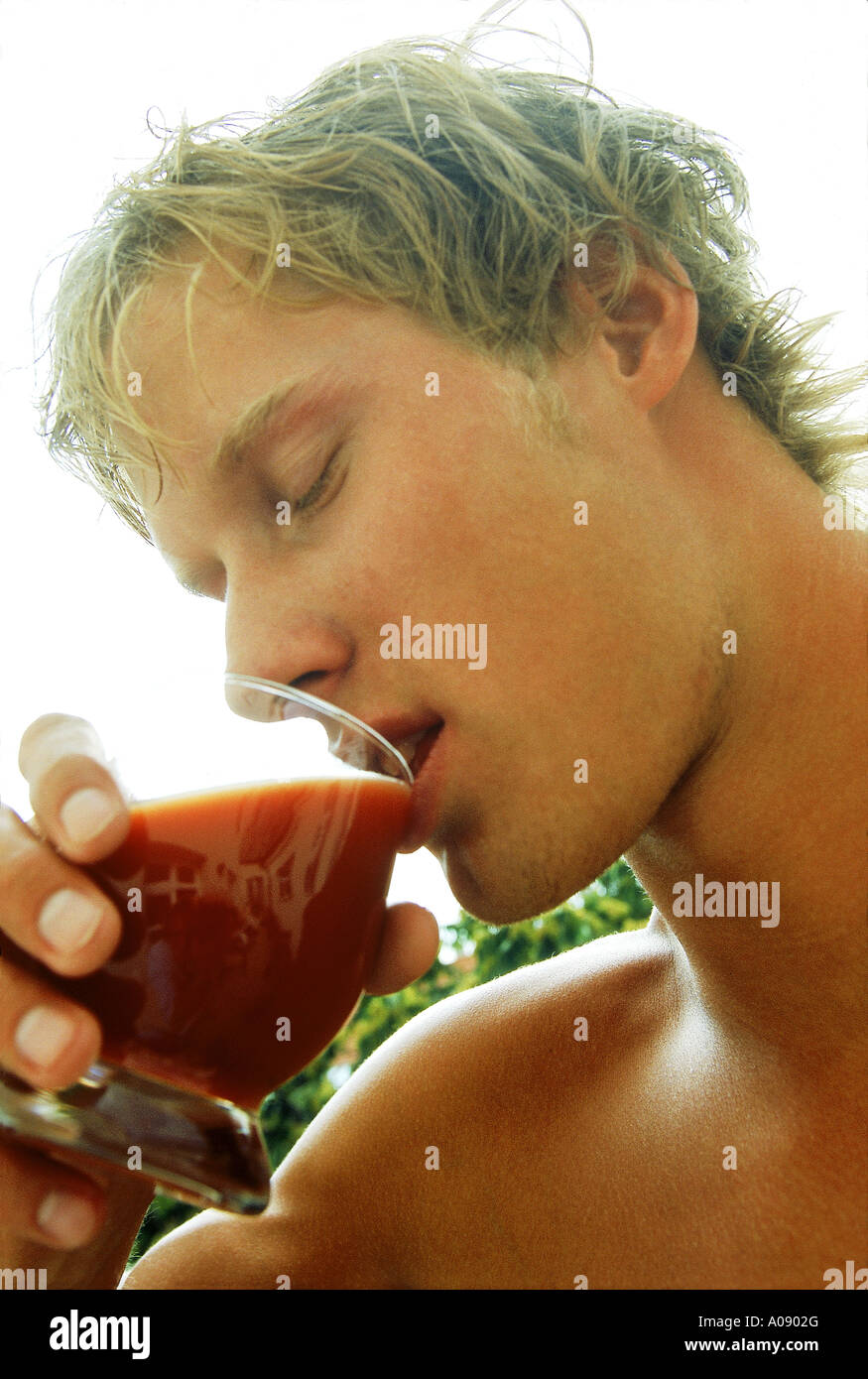 Portrait macho man drinking juice hi-res stock photography and images ...