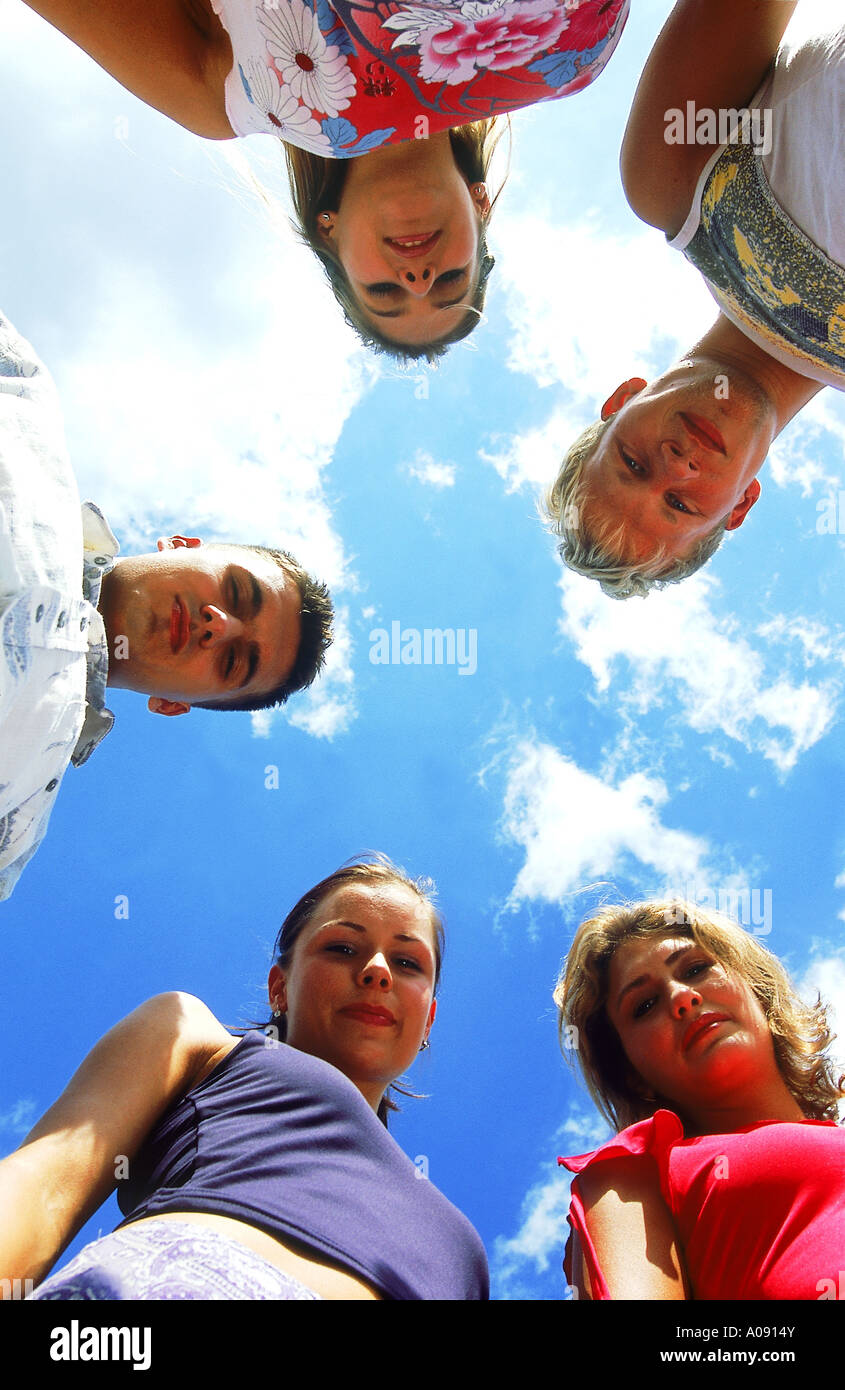 Portrait of a group of young people standing looking down Stock Photo ...
