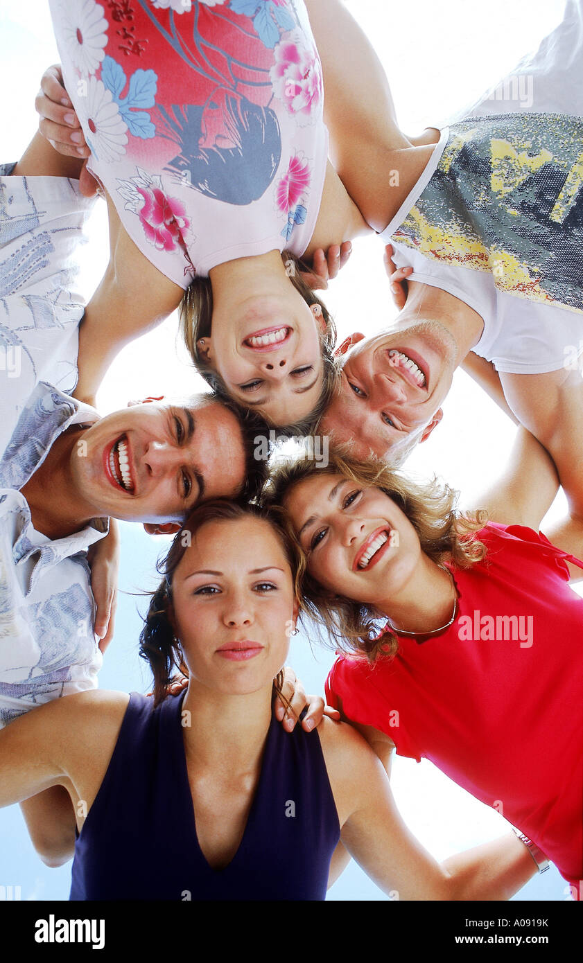 Men huddled together hi-res stock photography and images - Alamy