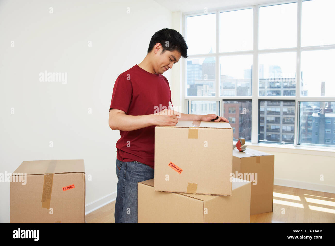 Man Packing Boxes Stock Photo - Alamy