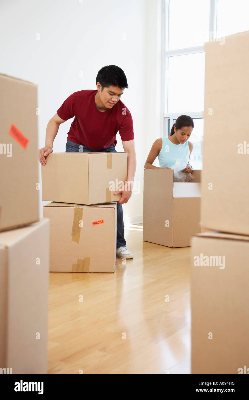 Couple Packing Boxes Stock Photo - Alamy