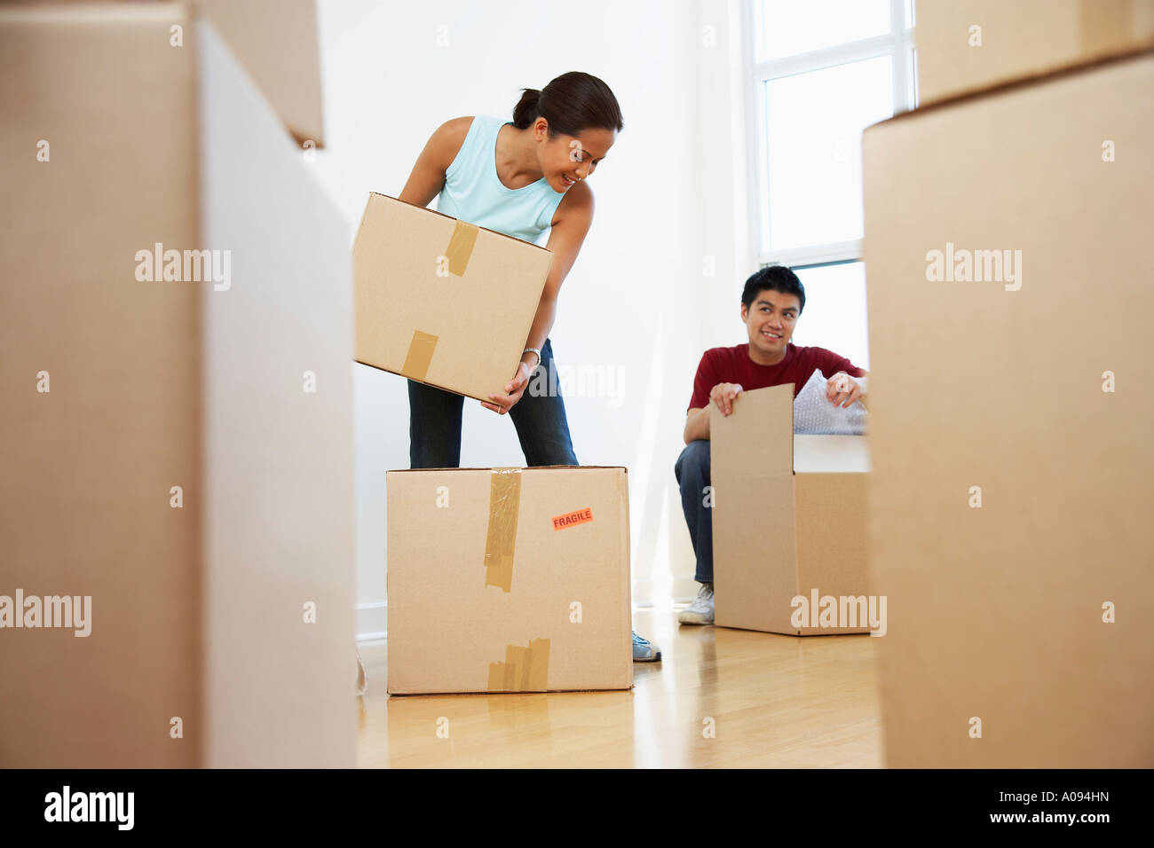 Couple Packing Boxes Stock Photo - Alamy