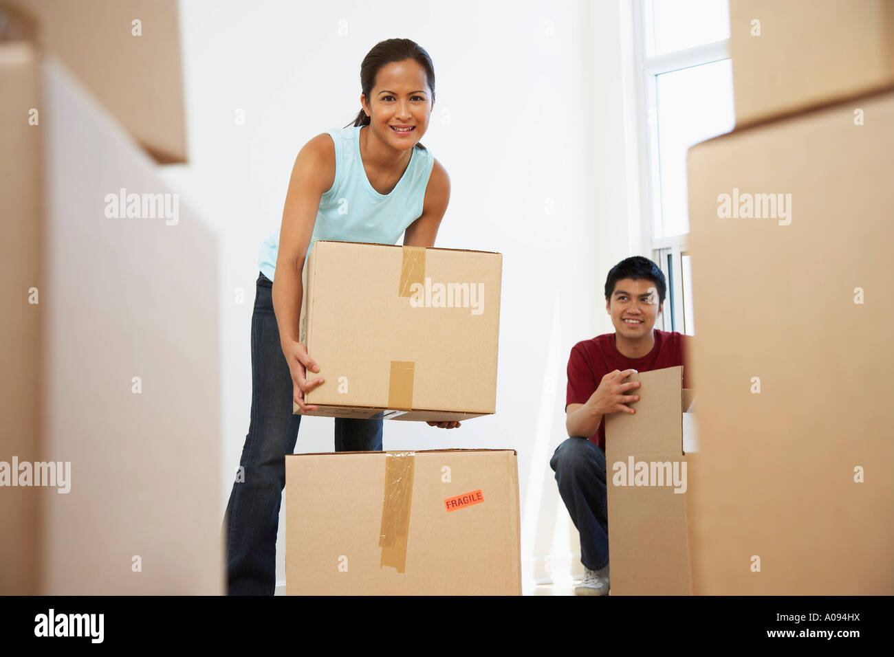 Couple Packing Boxes Stock Photo - Alamy