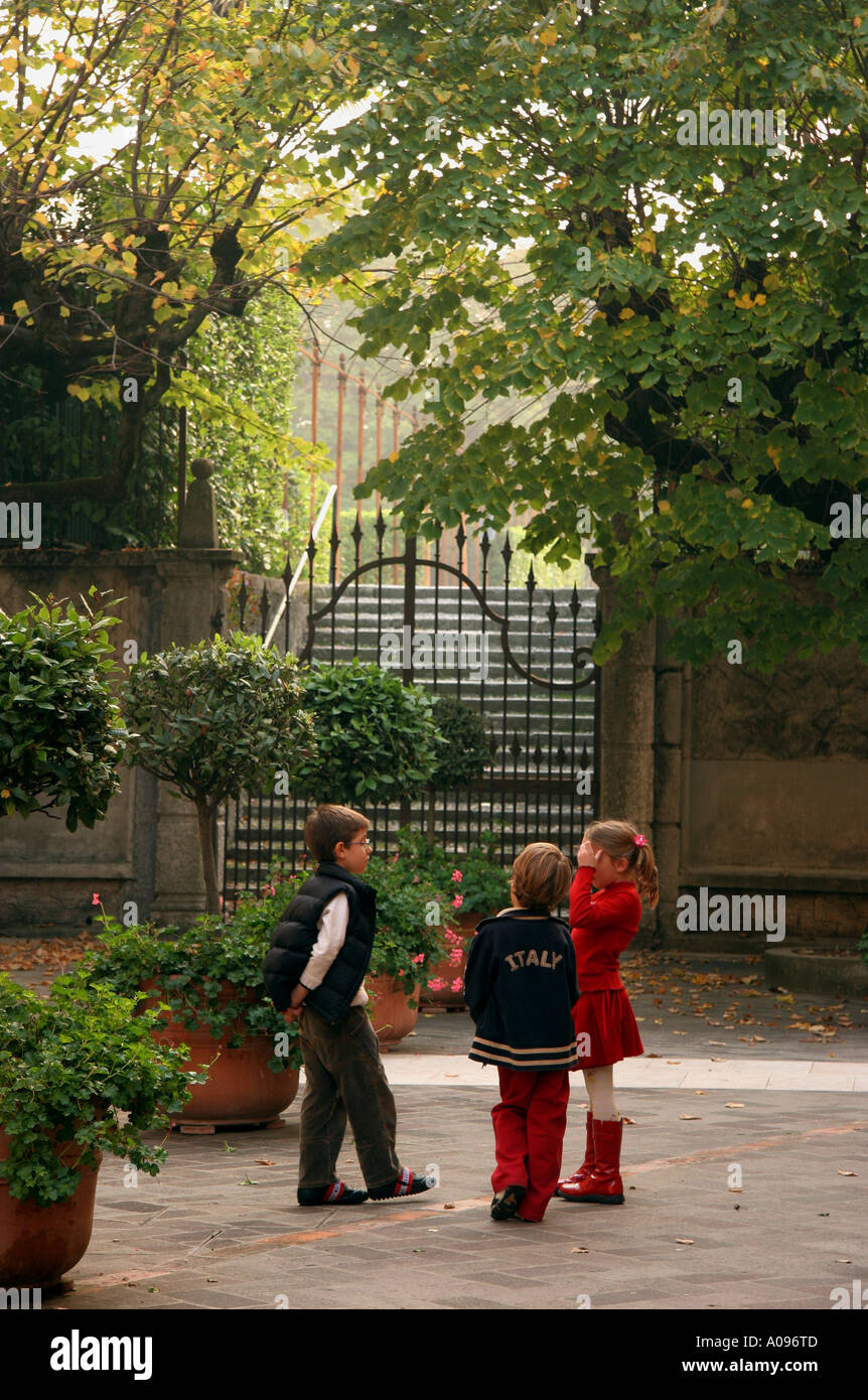 Children play in courtyard hi-res stock photography and images - Alamy