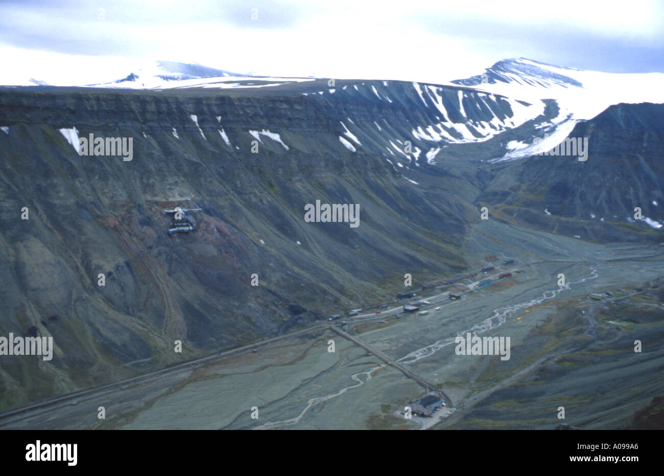 Entrance to mine adit, Nybyen hamlet below, and Larsbreen glacier to ...