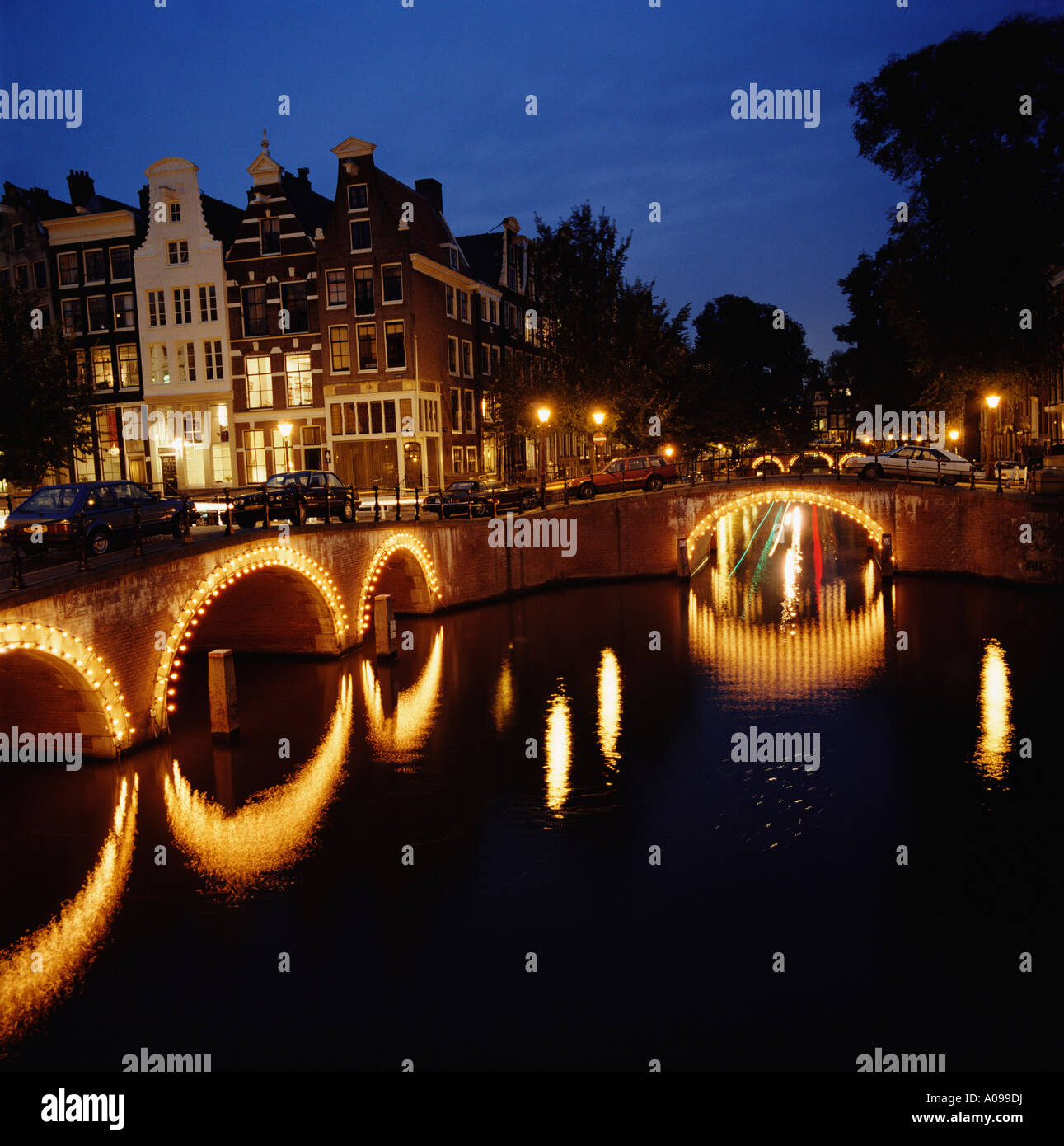 Illuminated canal bridges at night Amsterdam Holland Netherlands Stock ...