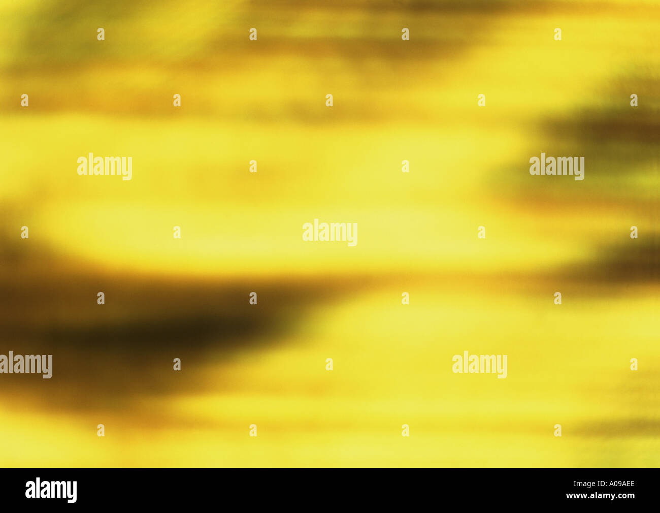 An abstract luminous light form with blurry streaks of bright yellow ...
