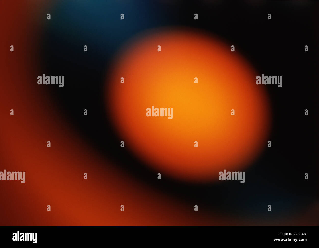 An abstract luminous light form of an orange sphere or orb floating ...