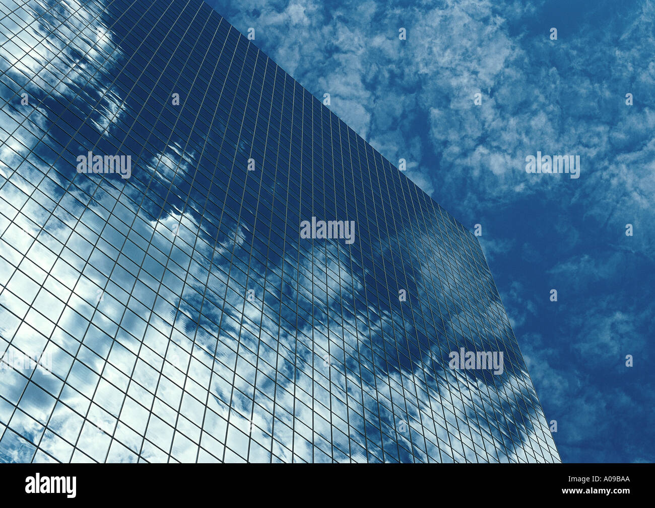 Skyscraper with blue sky and clouds reflecting in its windows Stock Photo - Alamy