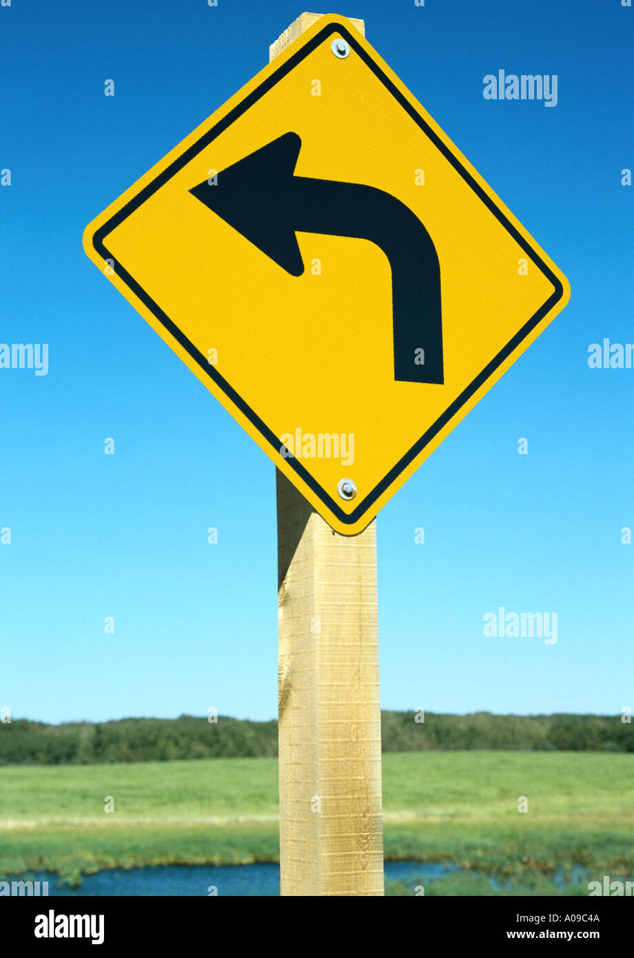 Diamond-shaped left bend directional road sign with curved arrow Stock ...