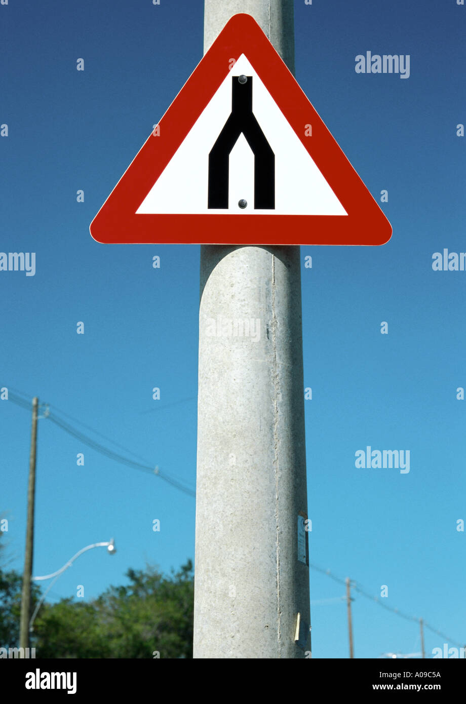Dual carriageway ends road sign Stock Photo - Alamy