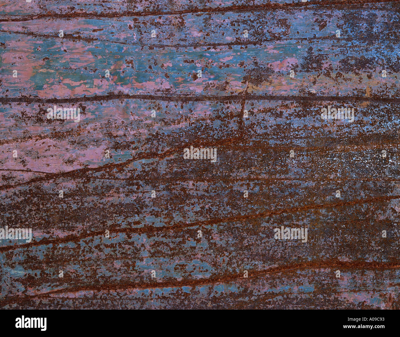 A close up of an aged and weathered rusted metal surface with peeling ...