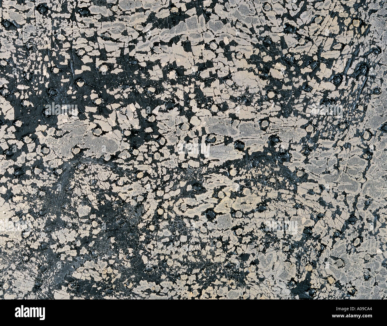 A close up of an aged and weathered cement or concrete surface with ...
