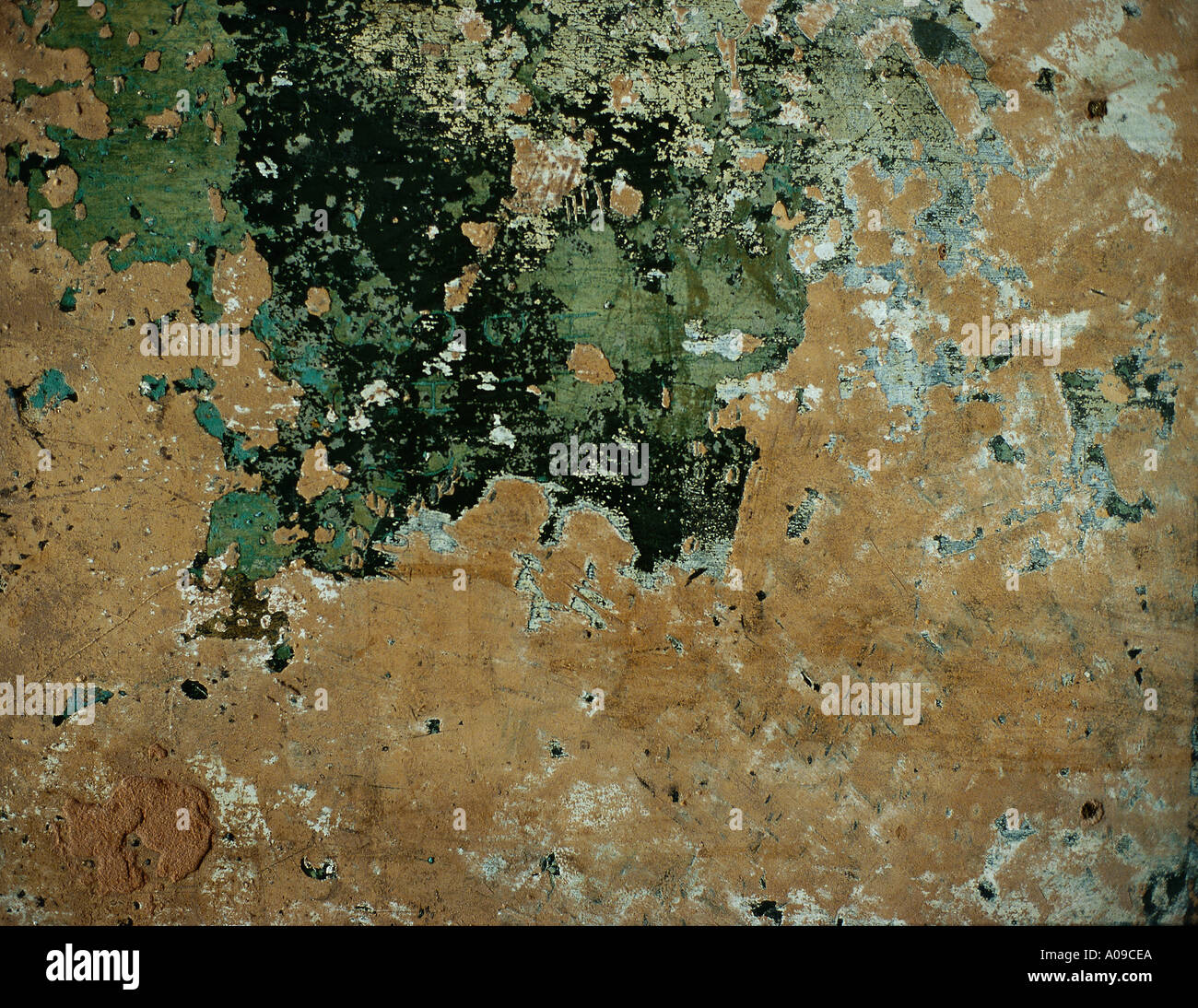 Weathered cement or concrete surface with flaking and peeling paint on ...