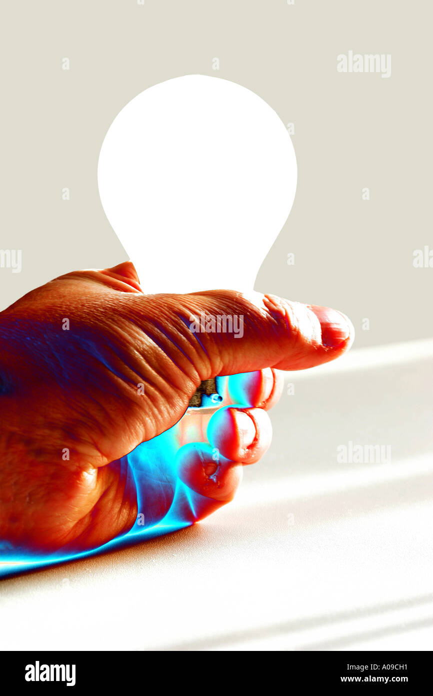 Hand Held Illuminated Light Bulb with Visible Energy Flowing Through ...