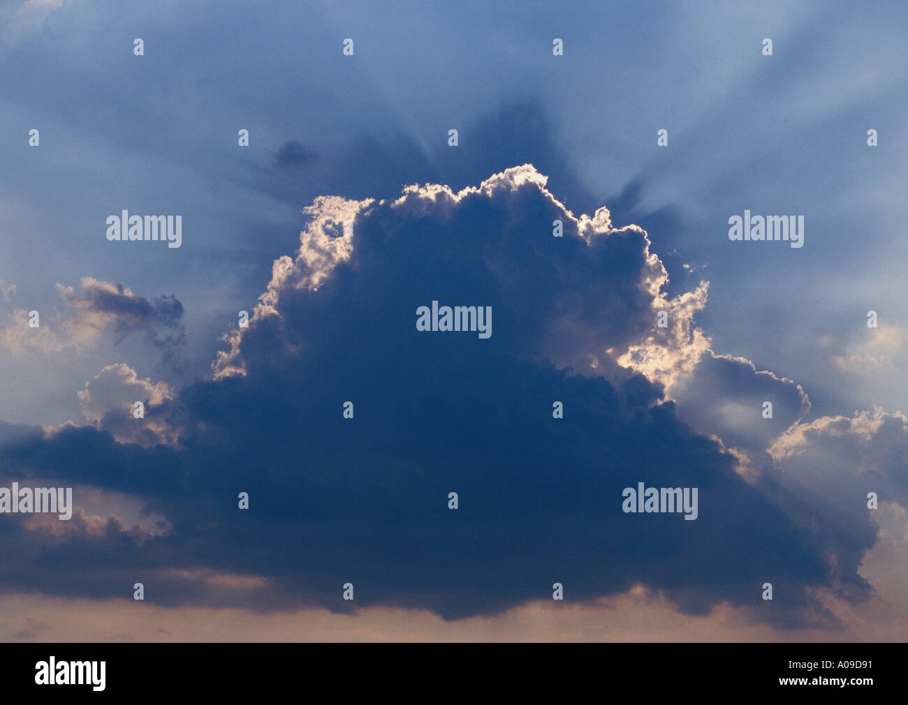 Bursting from behind clouds hi-res stock photography and images - Alamy