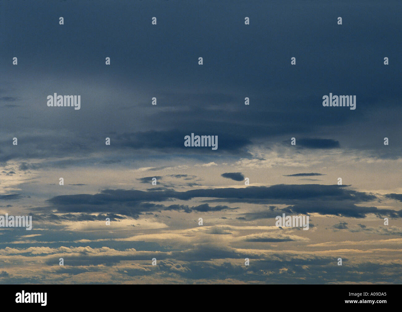 An overcast gray skyscape at dusk with distant clouds receding into the ...