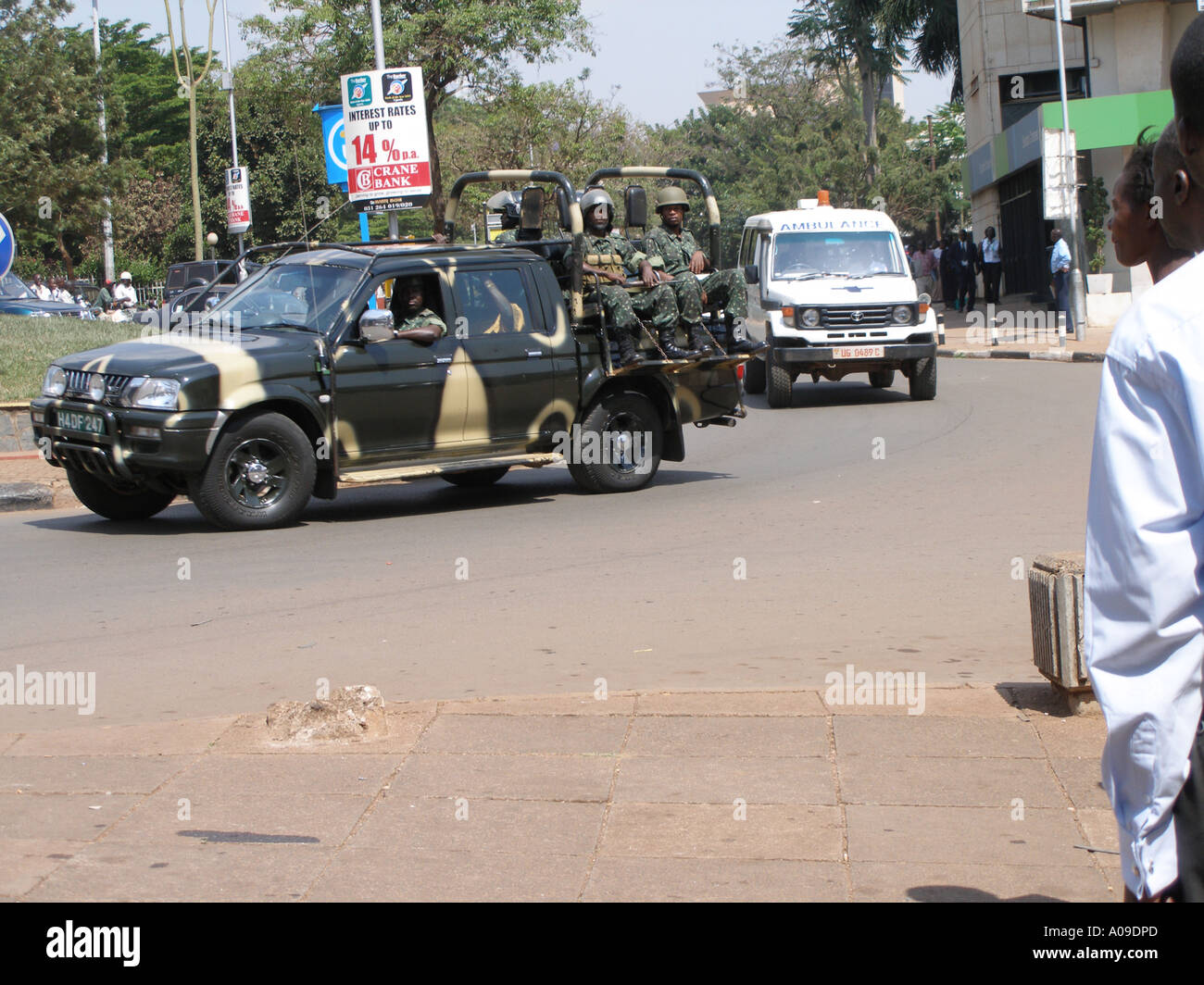 Military vehicle and ambulance, part of a VIP convoy in Kampala, Uganda ...