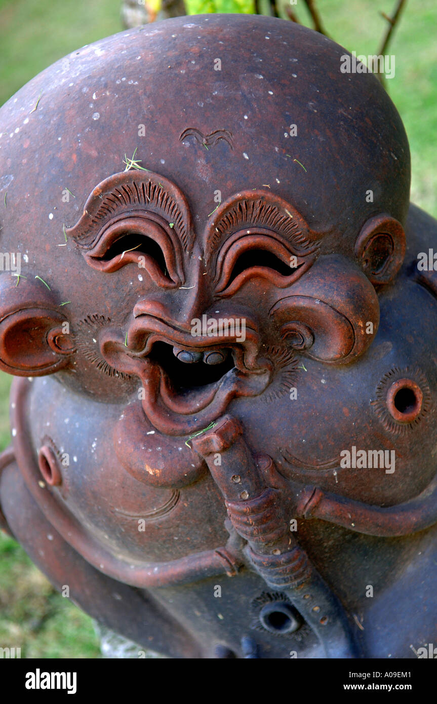 Decorative Indonesian pottery with smiling face Stock Photo - Alamy