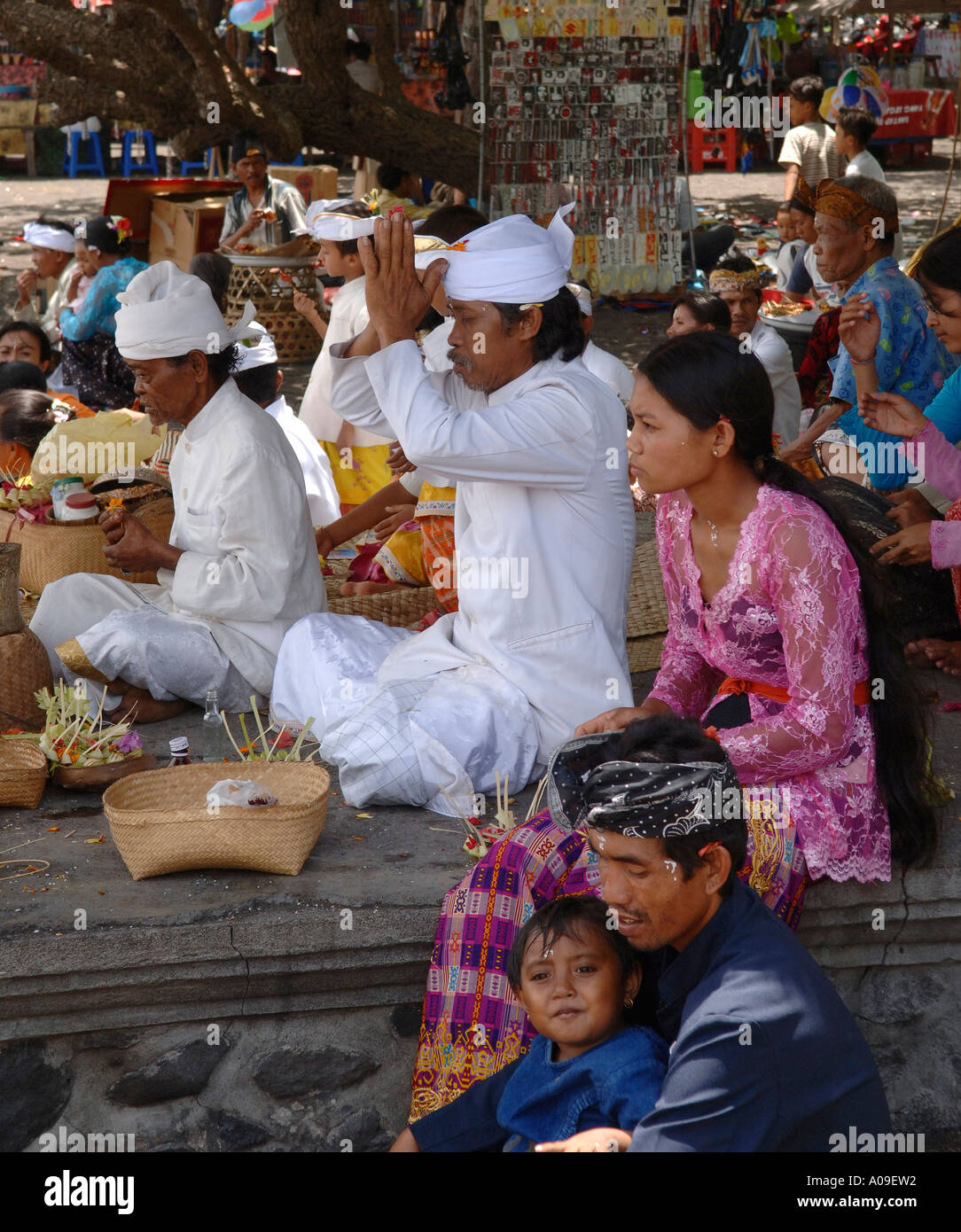 Balinese men praying at open air hindu religious festival, Bali ...