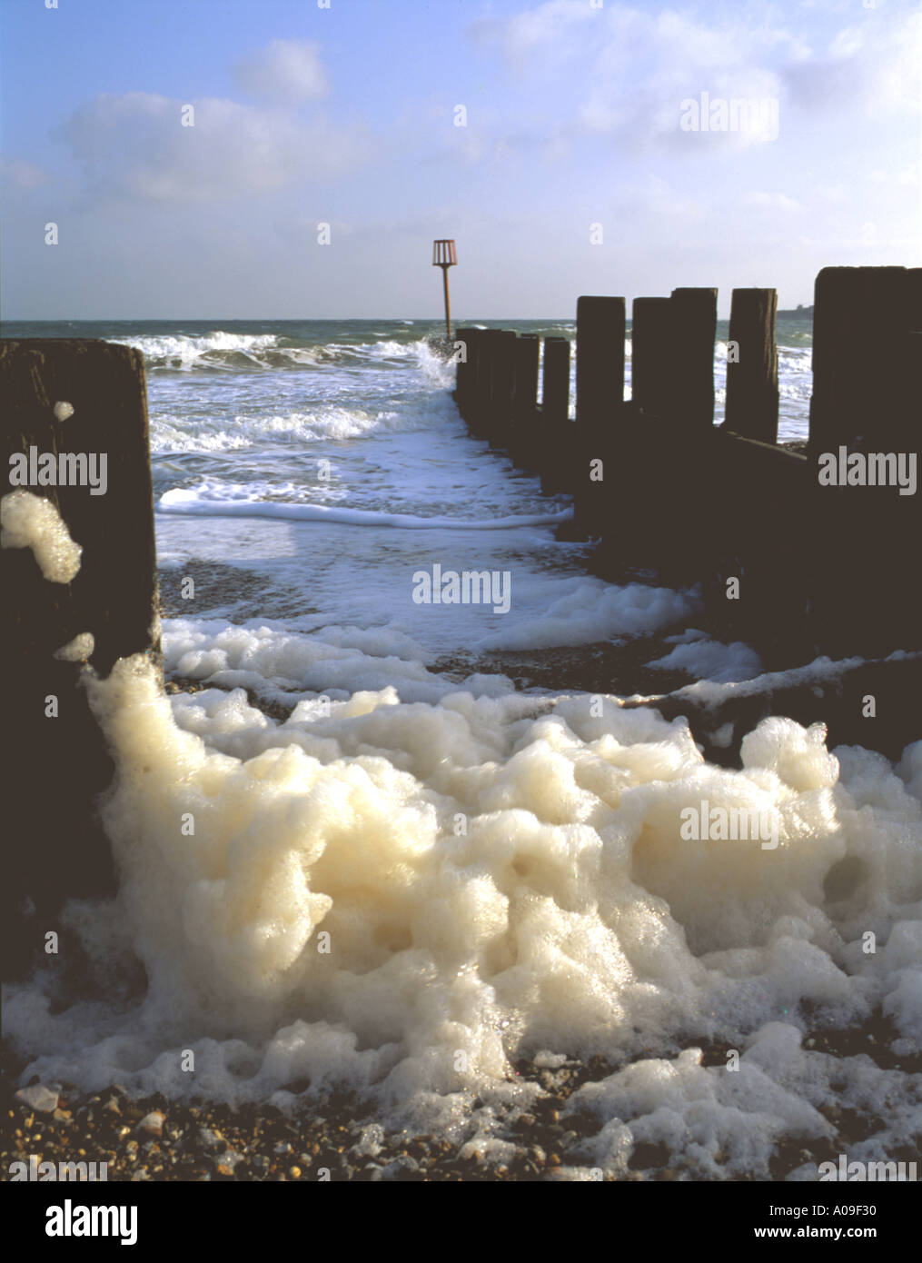 Coastal pollution caused by outfall with detergent foam on a beach, UK ...