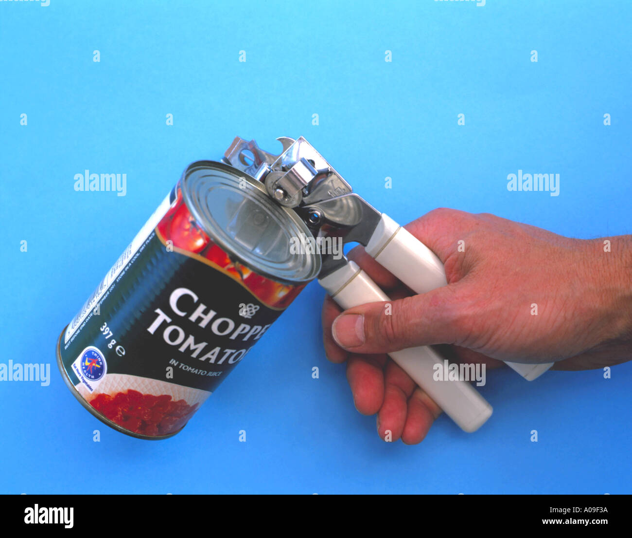 Using a can opener hi-res stock photography and images - Alamy