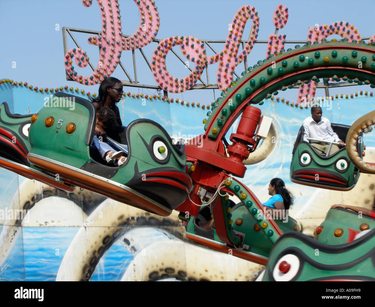 Swirling around in the octopus at a fun fair Stock Photo: 5671000 - Alamy