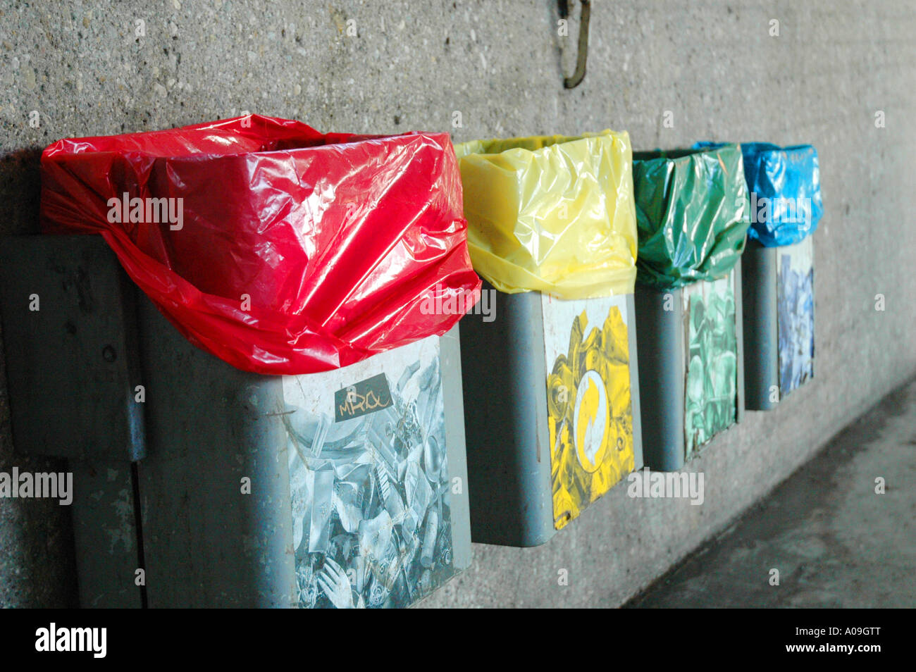trash can with colourful garbage bags Stock Photo - Alamy