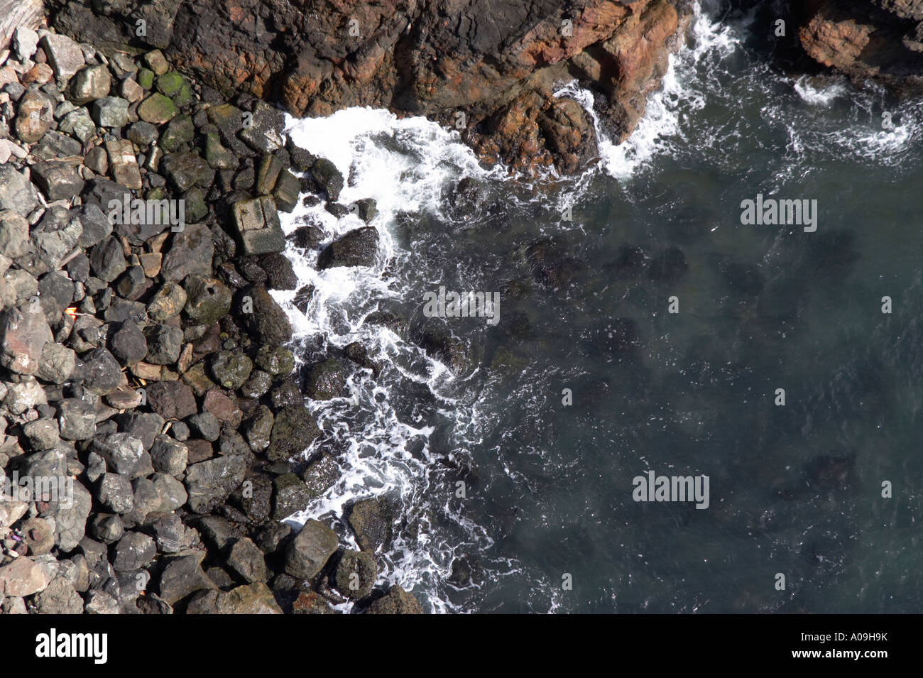 Stones in the surf Stock Photo - Alamy