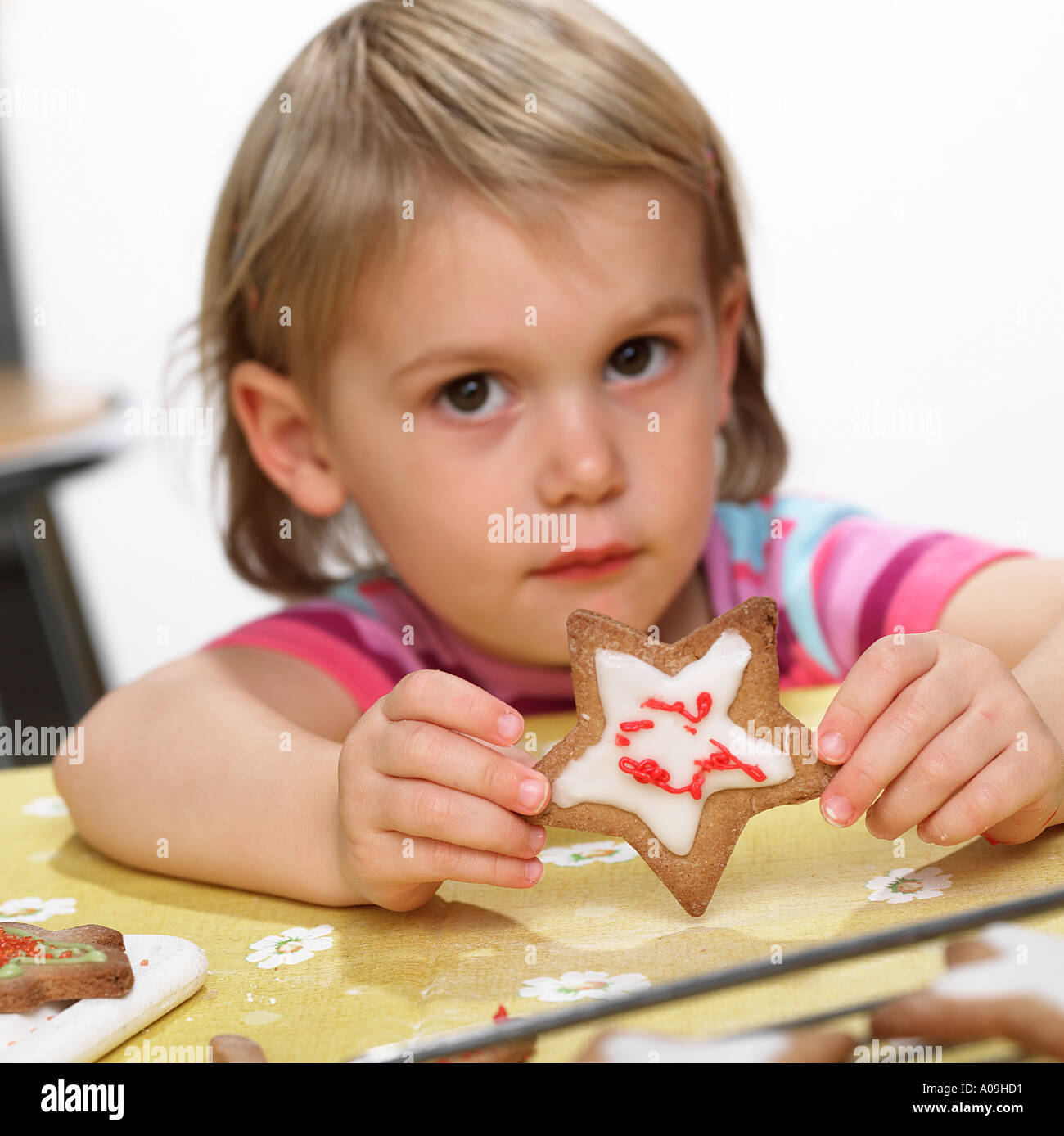 Little girl with Christmas star biscuit Keywords child children kids ...