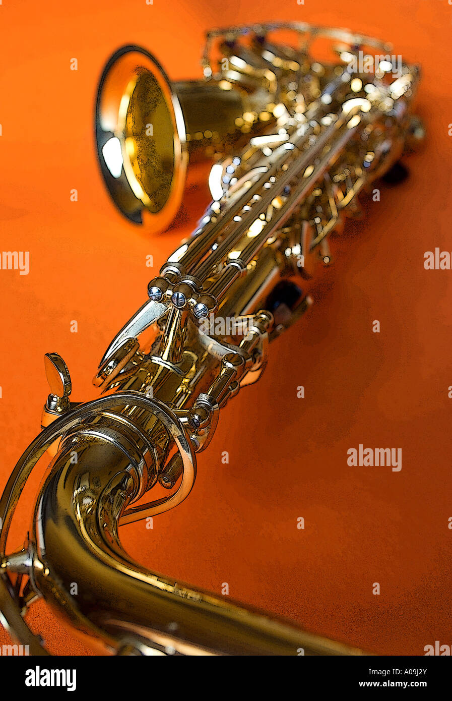 Alto Saxophone against orange background Stock Photo - Alamy