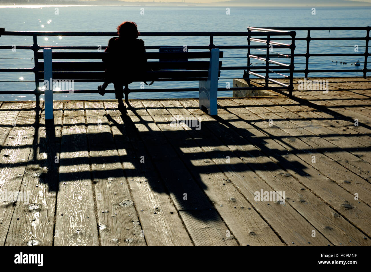 Woman sitting on Boardwalk Bench Santa Monica Pier CALIFORNIA Stock ...