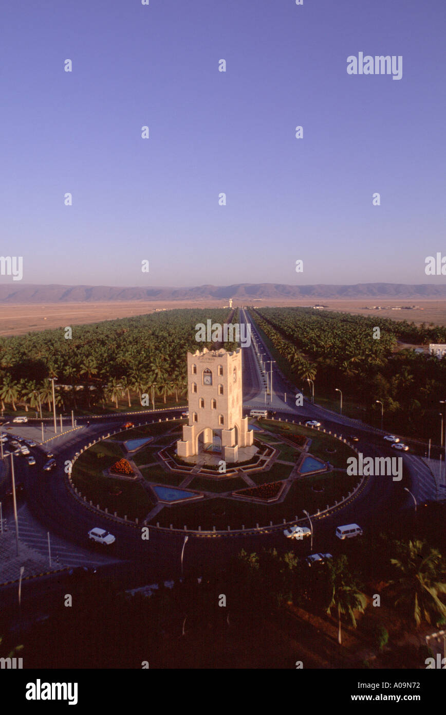 Oman. Salalah. Watchtower roundabout with coconut palm groves and ...
