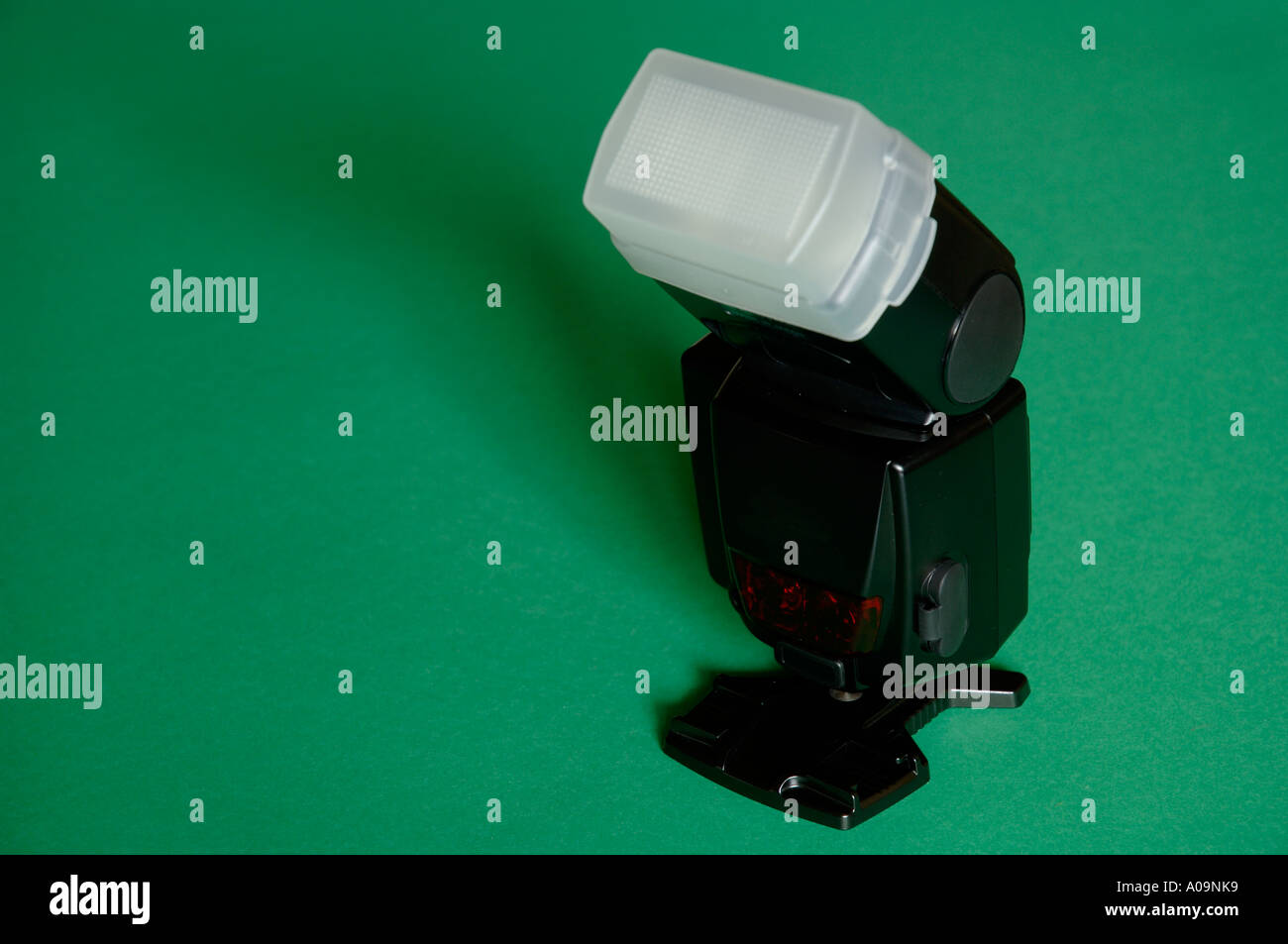 Wireless flash unit on green background Stock Photo - Alamy
