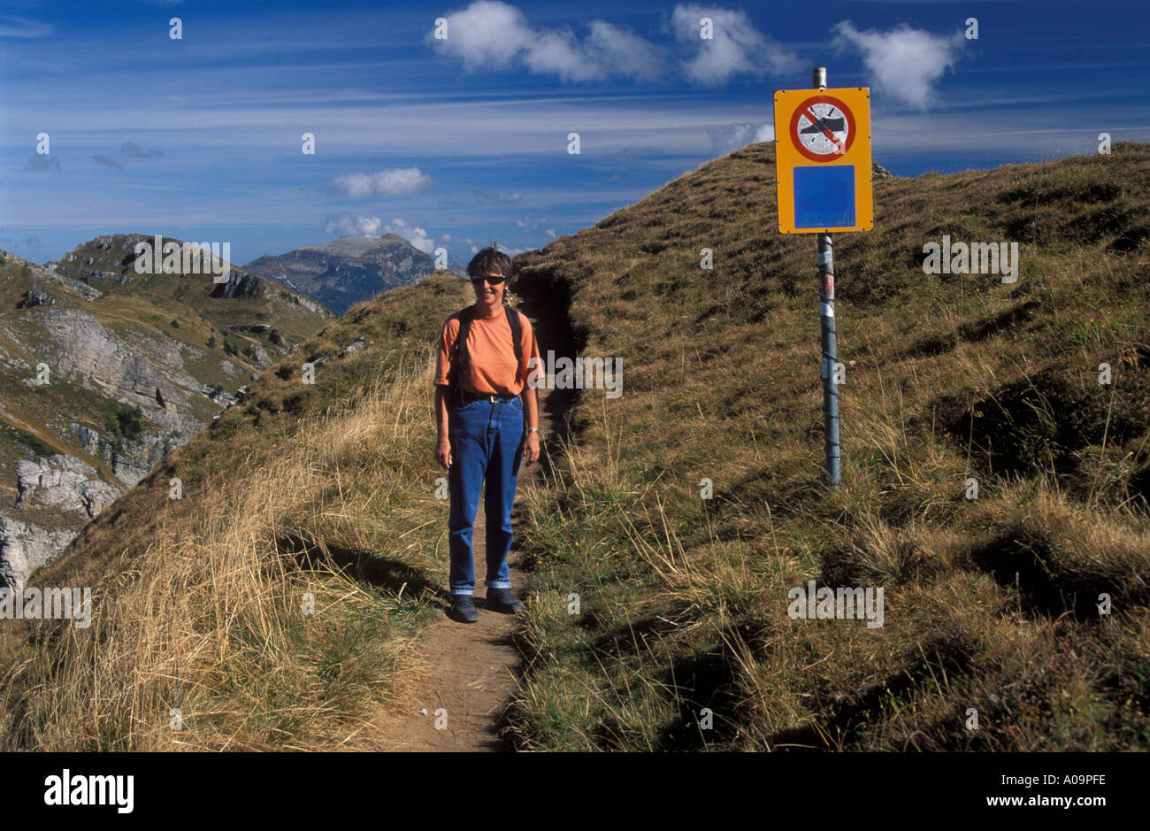 Hiker with warning sign to wear solid hikingshoes Gemmenalphorn Bernese ...
