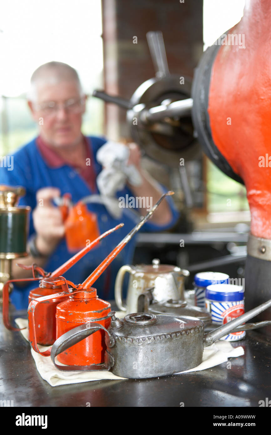 Engineer oiling a steam engine in a heritage museum Stock Photo - Alamy