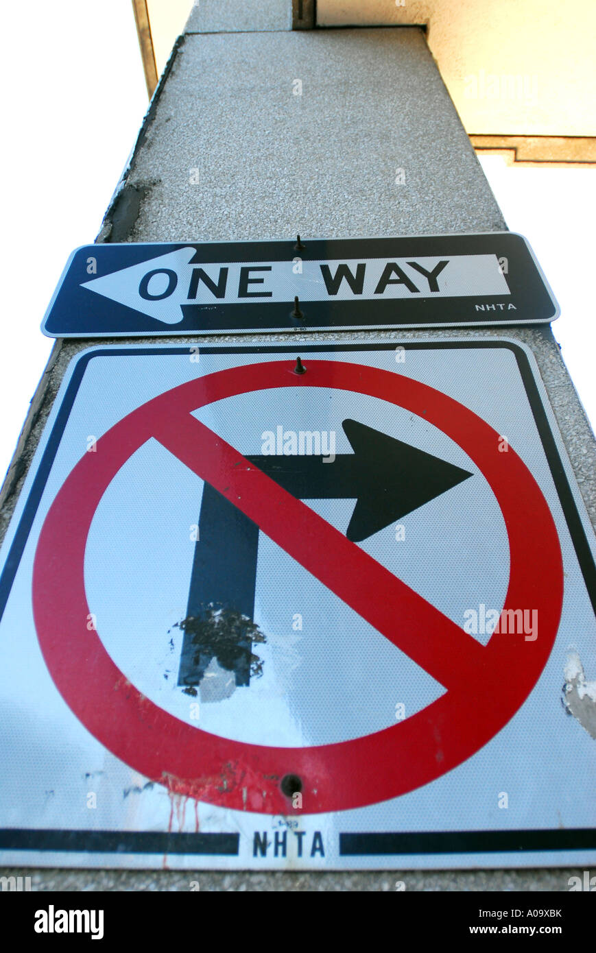 One way street sign with wrong way turn signs and signage Stock Photo ...