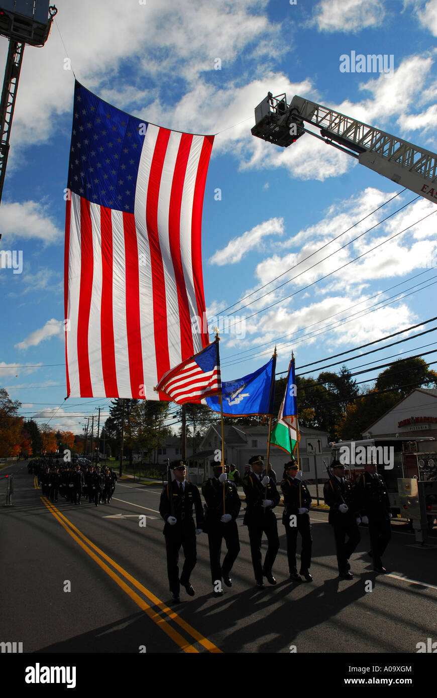 Police officers parade in front of the casket of an officer killed in ...