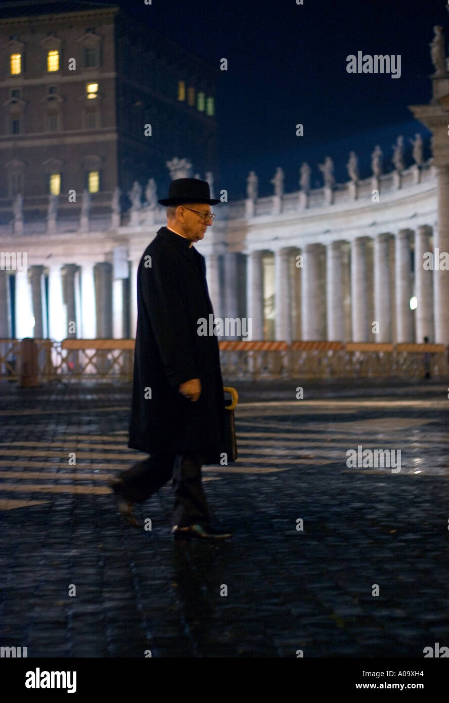 Priest walking at St. Peter's Square, Rome on his way home from work at ...