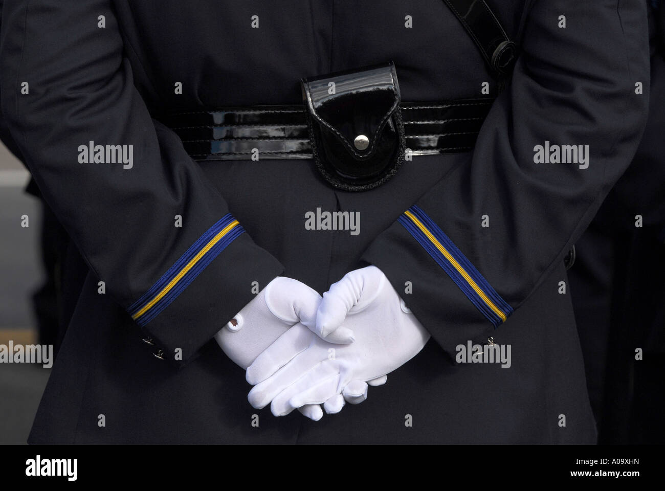 Police officer stands at attention during a funeral for Stock Photo - Alamy