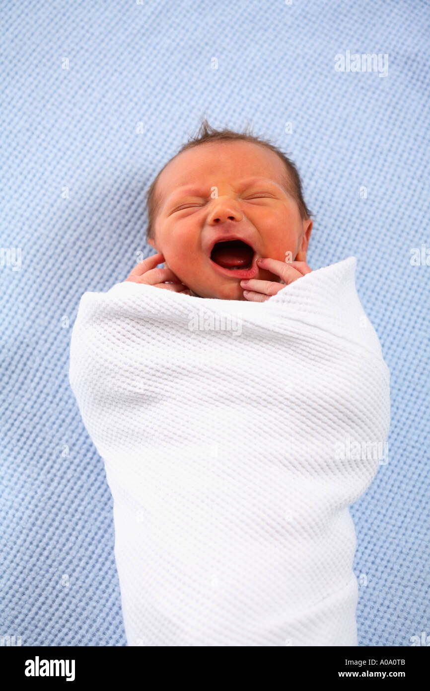 Newborn baby yawning Stock Photo - Alamy