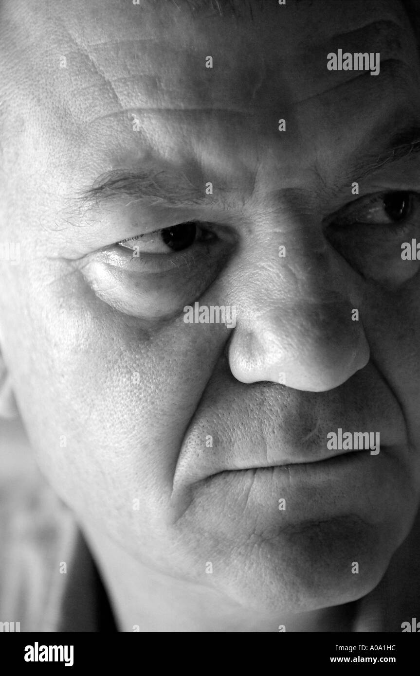 Man closeup, looking direct, intense, thinking, considering, angry ...