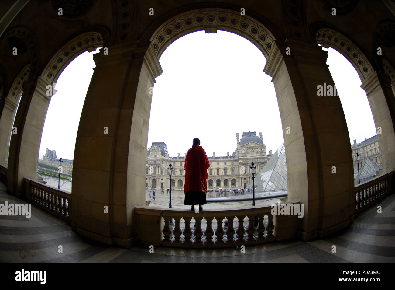 red raincoat girl in the rain at the louvre Stock Photo - Alamy