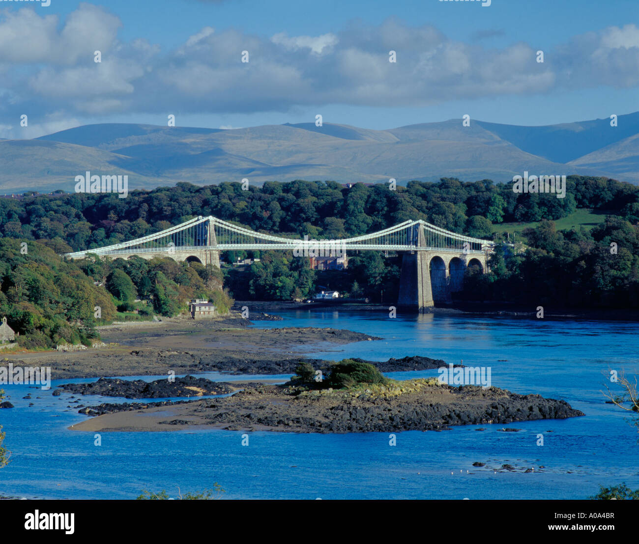 Menai Bridge over the Menai Strait, with mountains of Snowdonia beyond ...