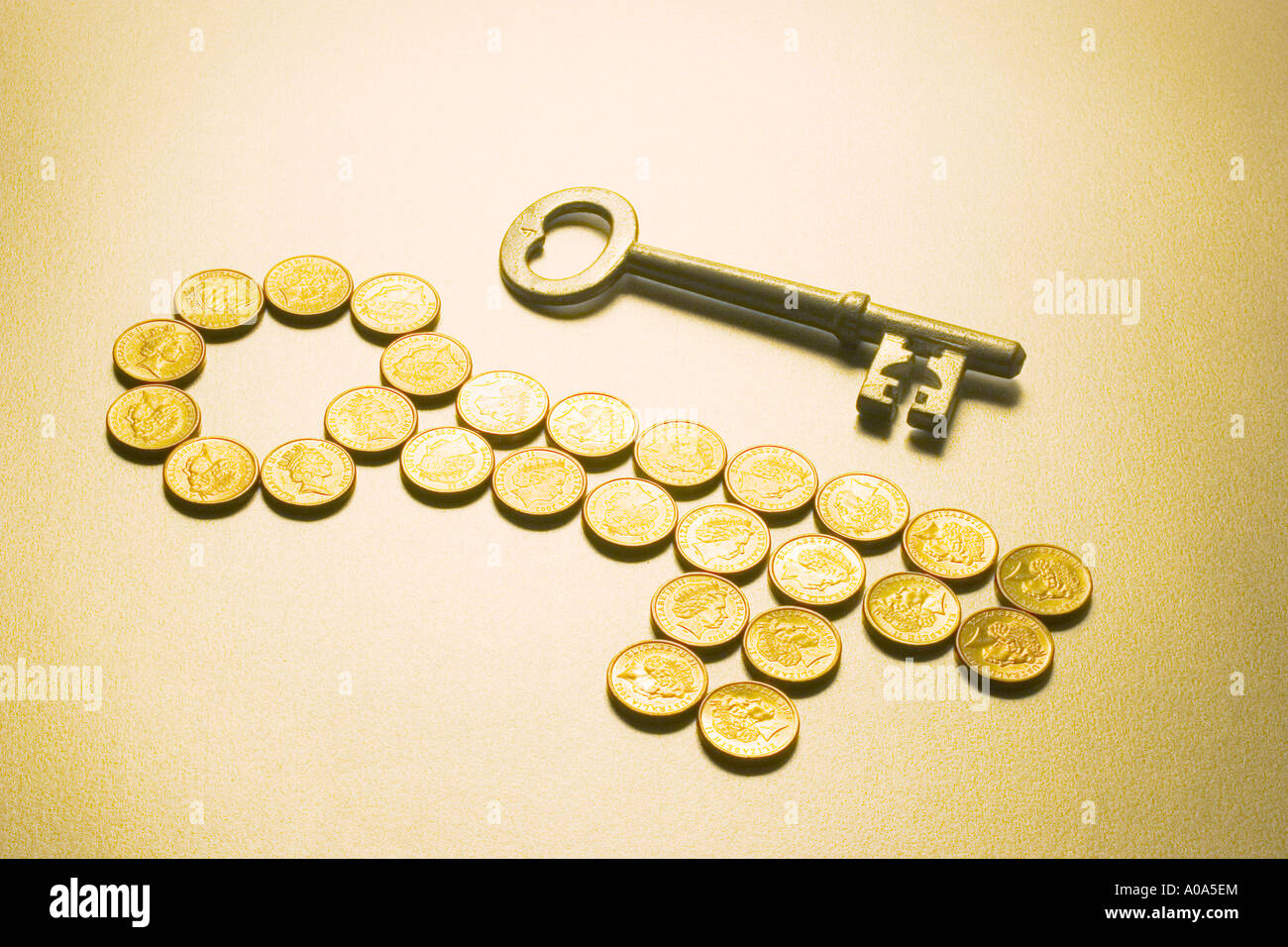 Coins and Skeleton Key Stock Photo - Alamy