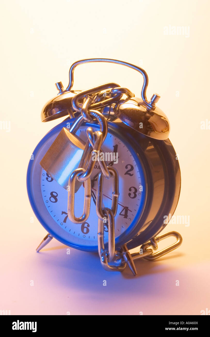 Alarm Clock with Chain and Padlock Stock Photo - Alamy