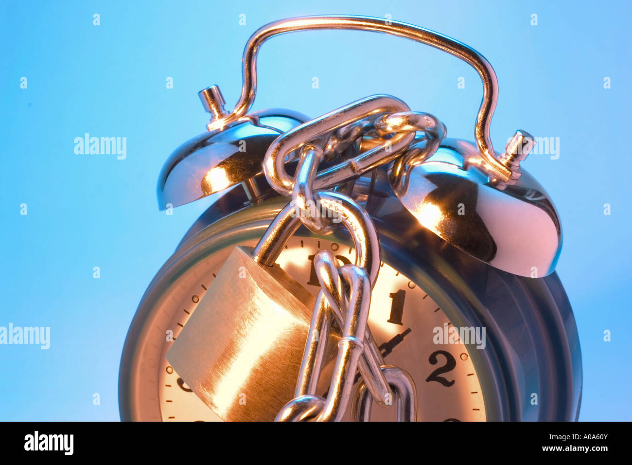 Alarm Clock with Chain and Padlock Stock Photo - Alamy