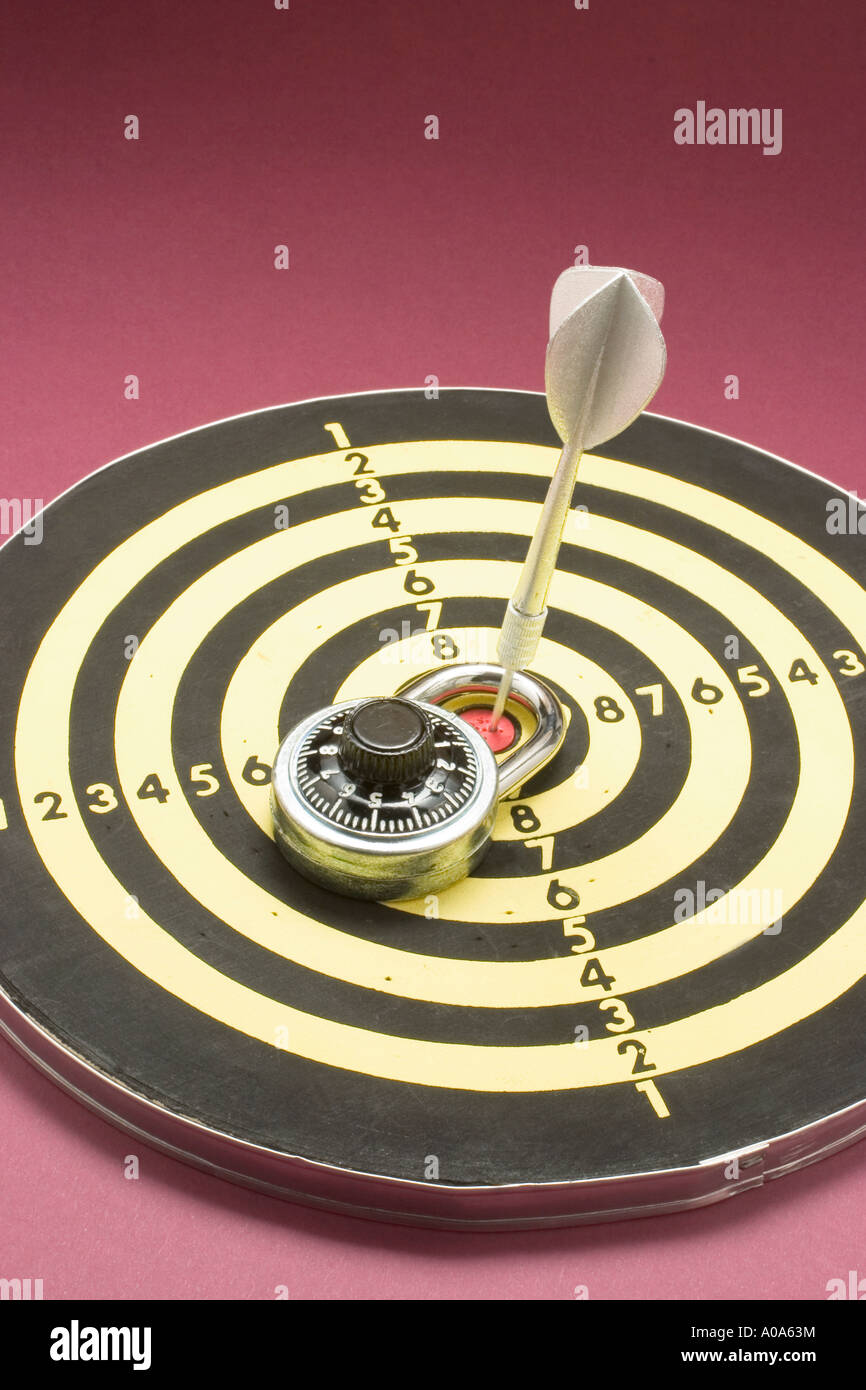 Combination Lock and Dart on Dart Board Stock Photo - Alamy