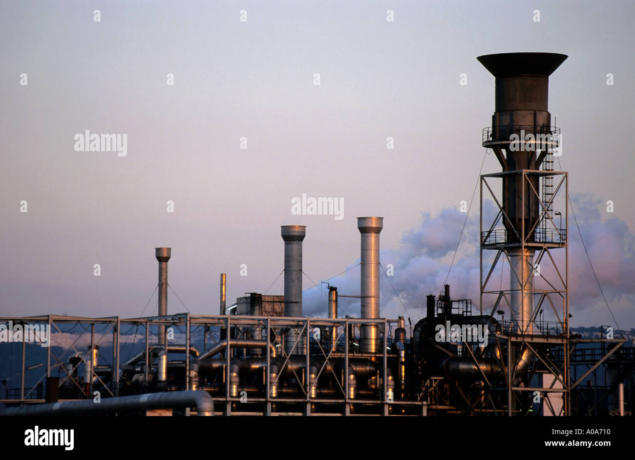 Petroleum refinery chimneys at dusk, France Stock Photo - Alamy